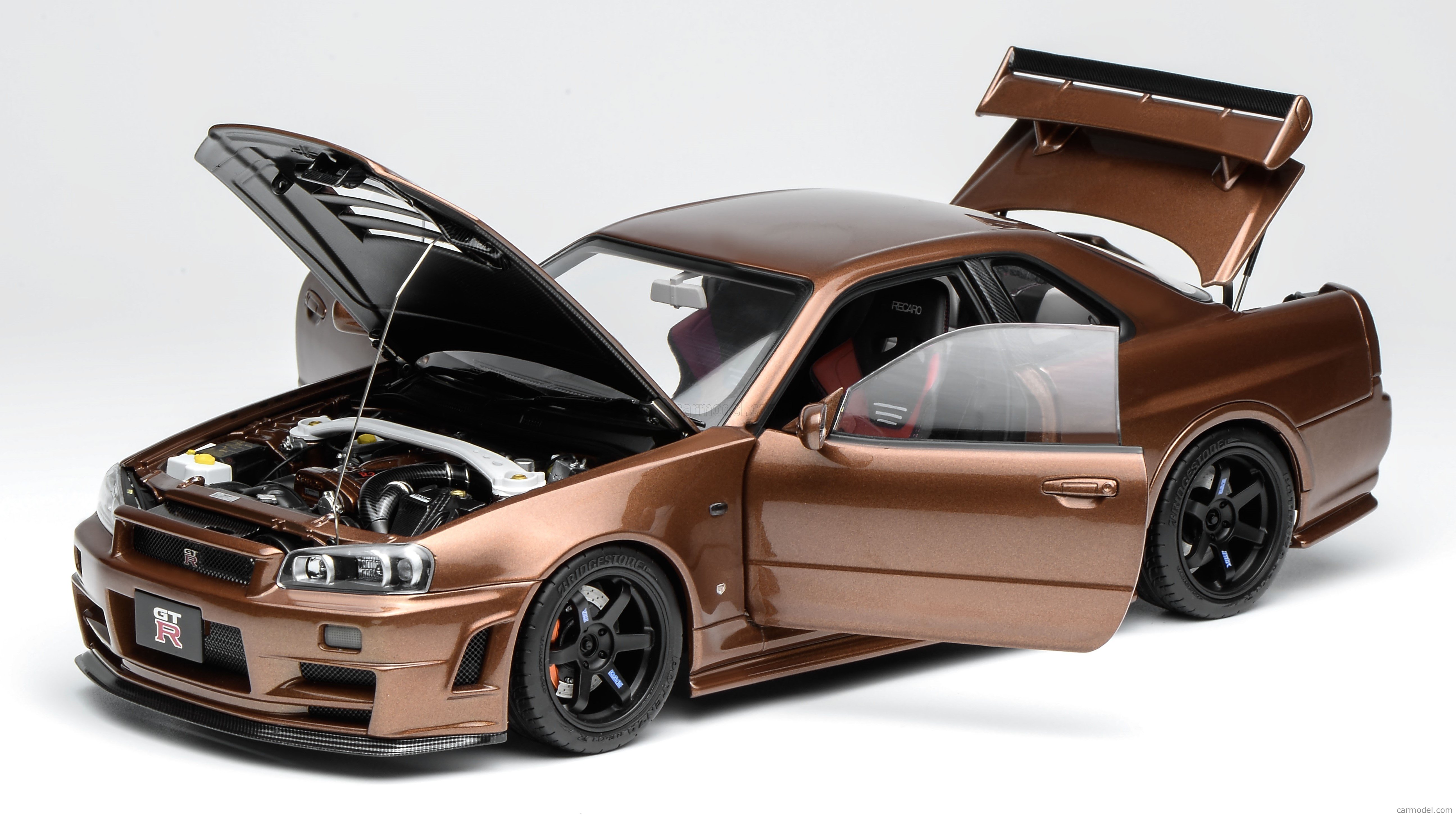 MOTORHELIX M83414 Scala 1/18 | NISSAN SKYLINE GT-R (R34) COUPE CUSTOMIZED VERSION 1999 COPPER MET